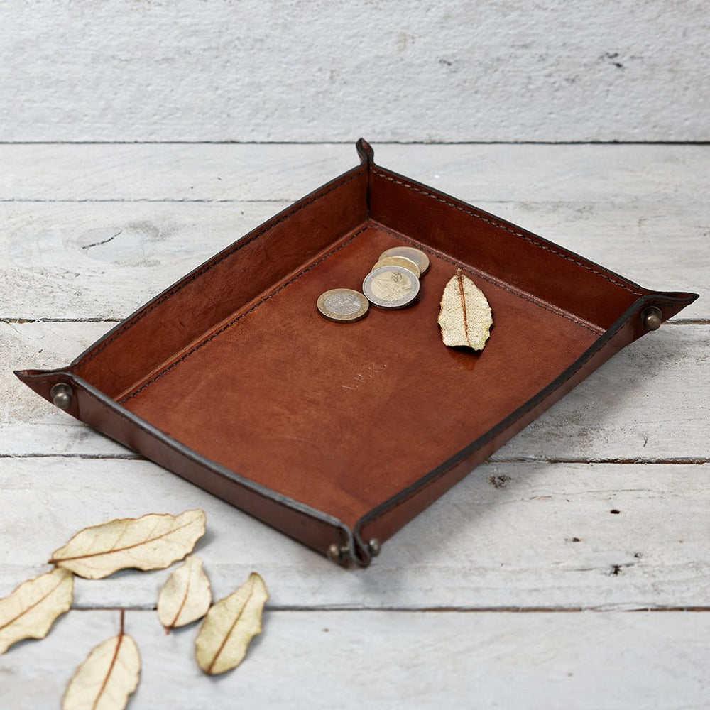 Leather Cointray. Personalise in centre. Corner studs. Neat storage