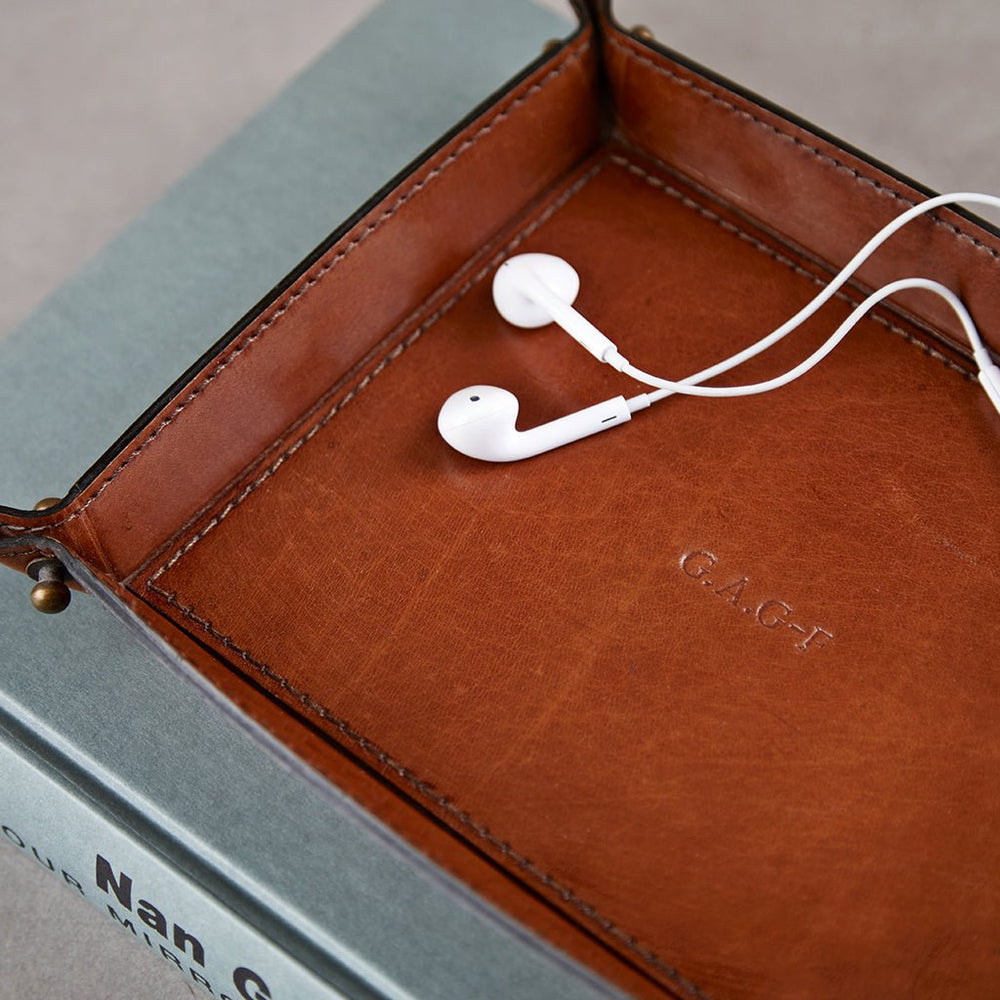 Leather Cointray. Personalise in centre. Corner studs. Neat storage